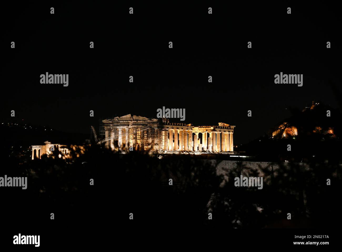 The temple of the Parthenon is pictured with its lighting switched on ...