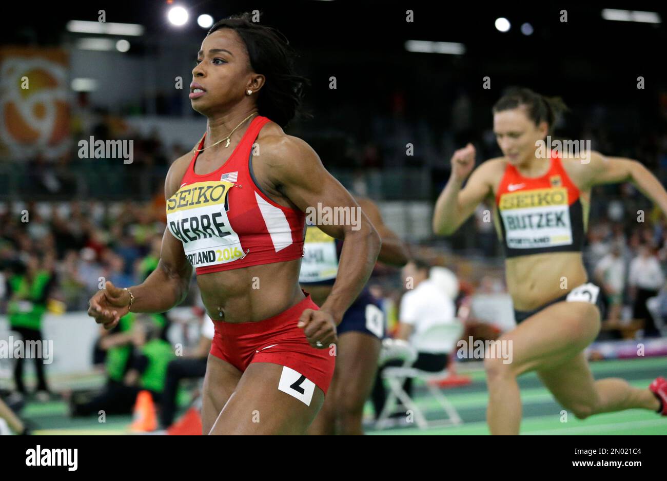 United States' Barbara Pierre, left, wins a heat of the women's 60 ...