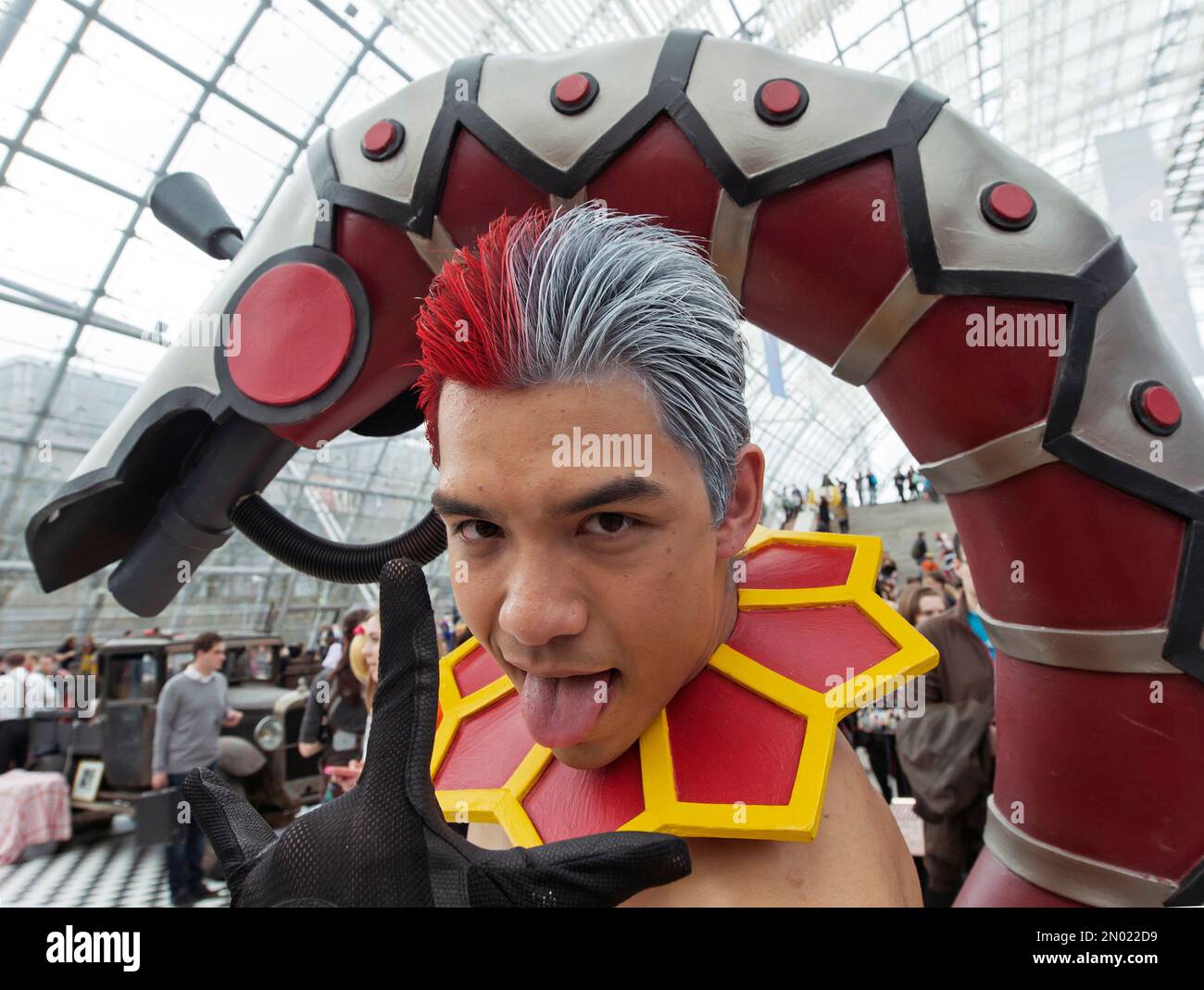 A cosplayer dressed in a fantasy costume performs during the Manga ...