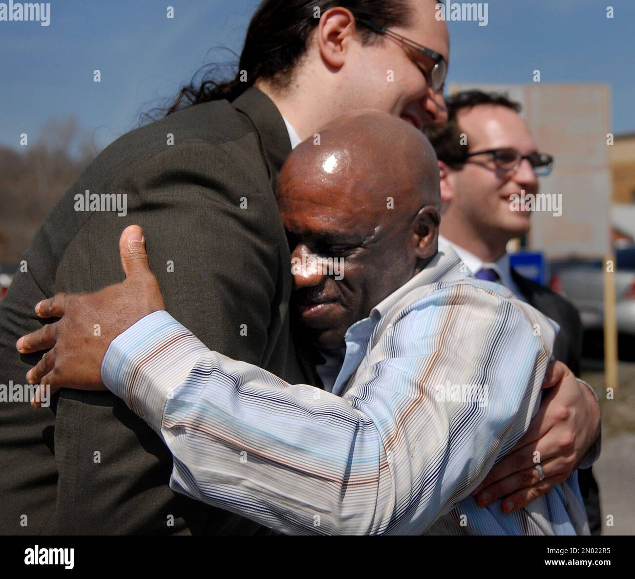 FILE - In this Thursday, March 17, 2011 file photo, Eric Caine, right ...