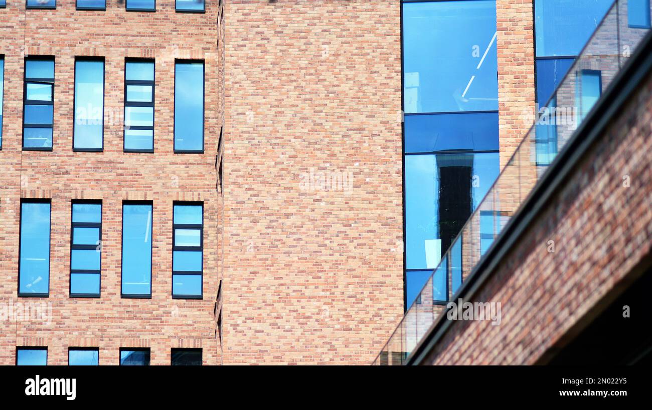 Modern brick and glass facade of the office building. A contrasting ...