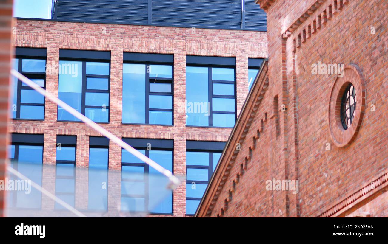 Modern brick and glass facade of the office building. A contrasting ...
