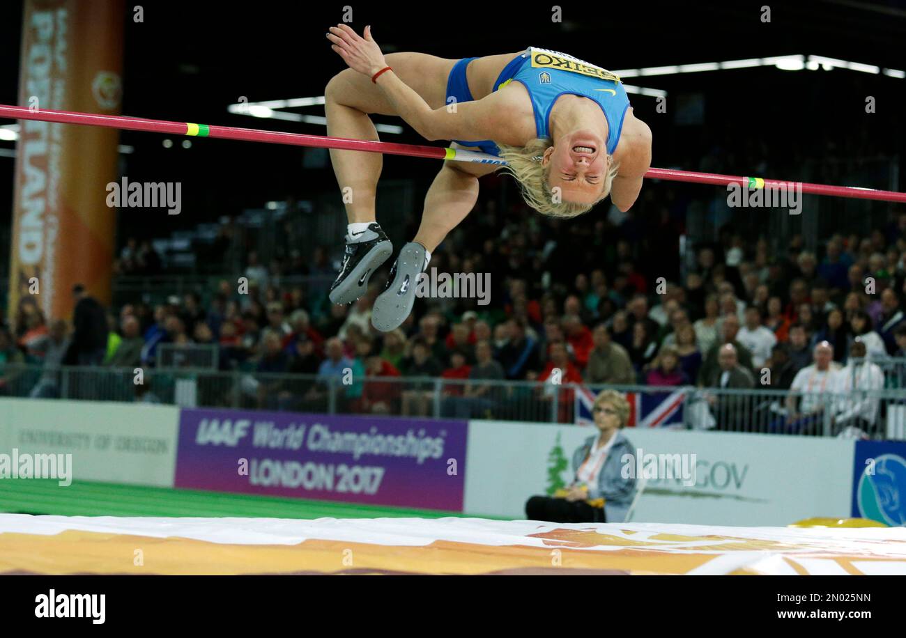 Ukraine's Alina Fodorova clears the bar in the women's high jump of the ...