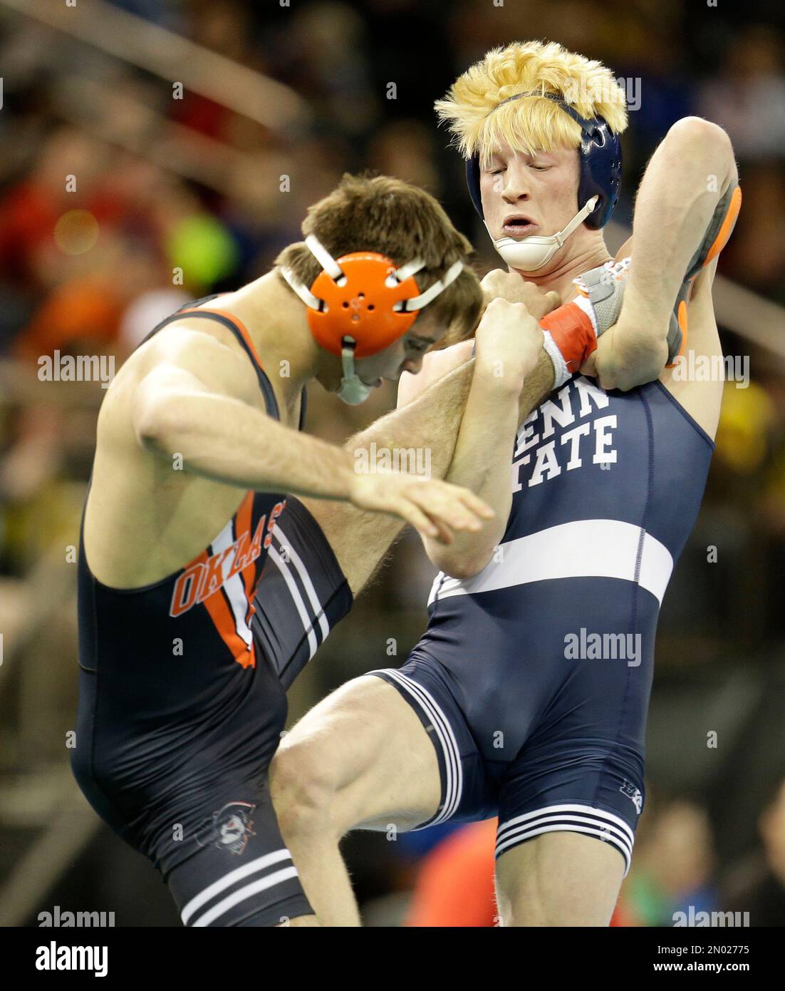 Penn State's Bo Nickal, right, grabs the leg of Oklahoma State's ...