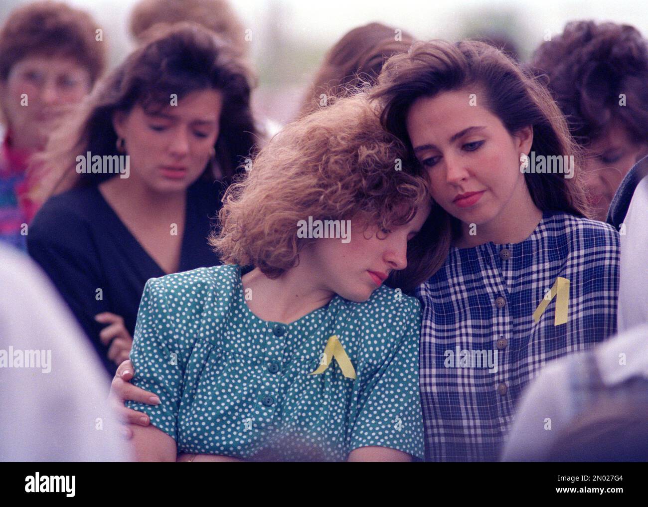 Suzane Harvell, left, Marisa Whitfield, and Jennifer Gray share a quiet ...