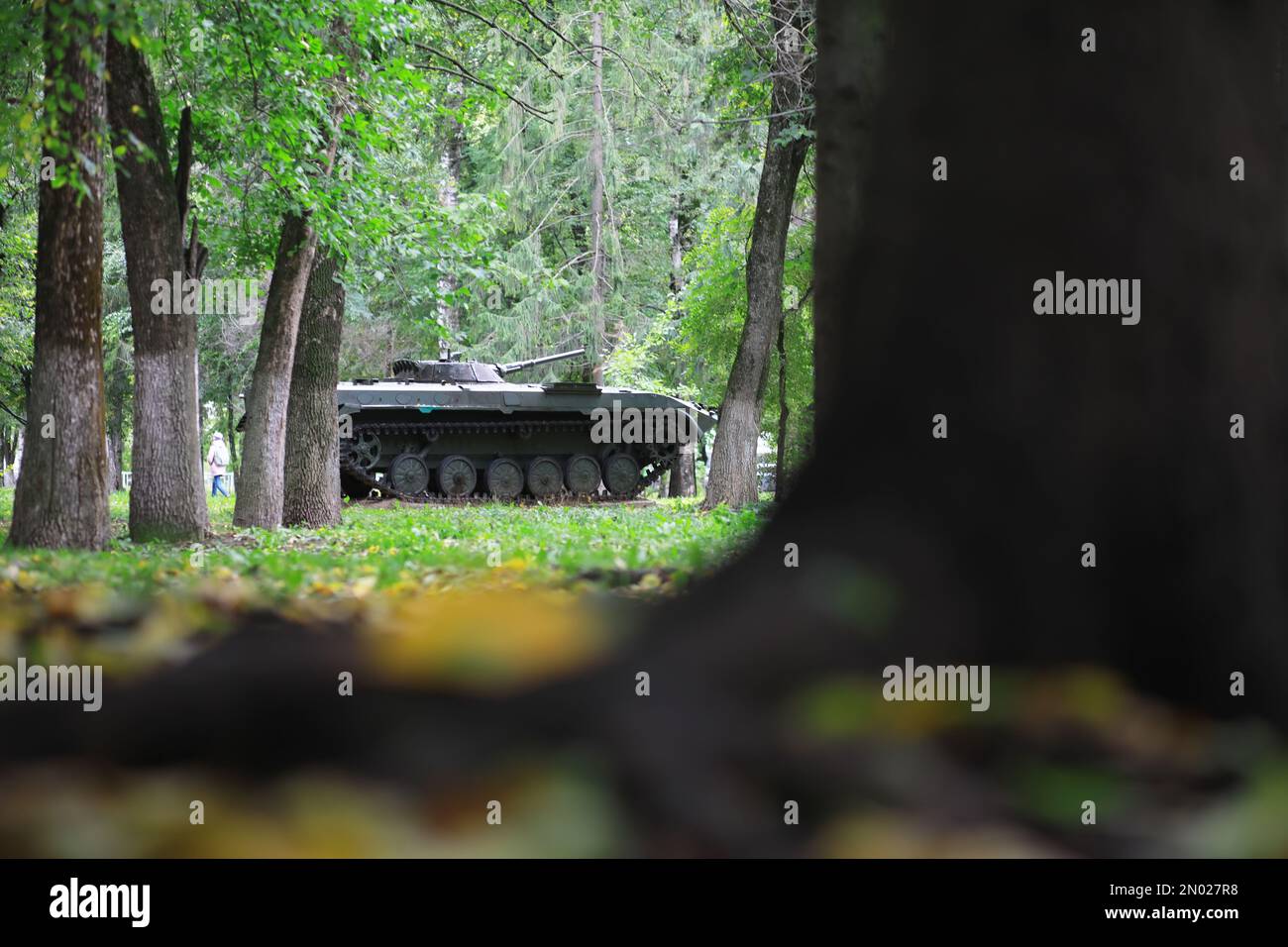 A selective focus shot of an abandoned military tank in forest Stock ...