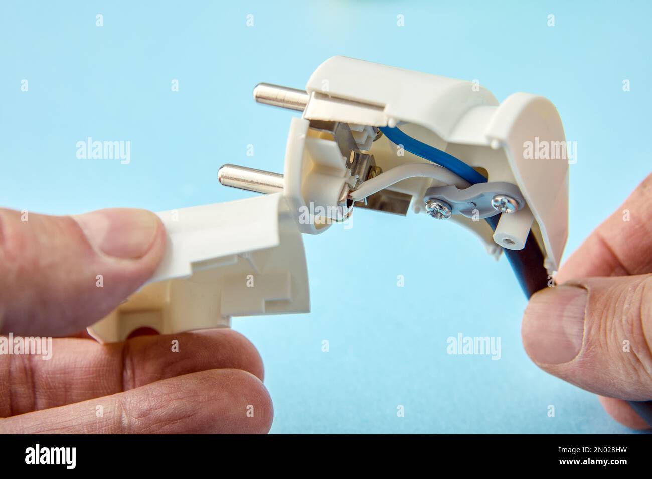Folding or collapsible electric plug for power cord Stock Photo - Alamy