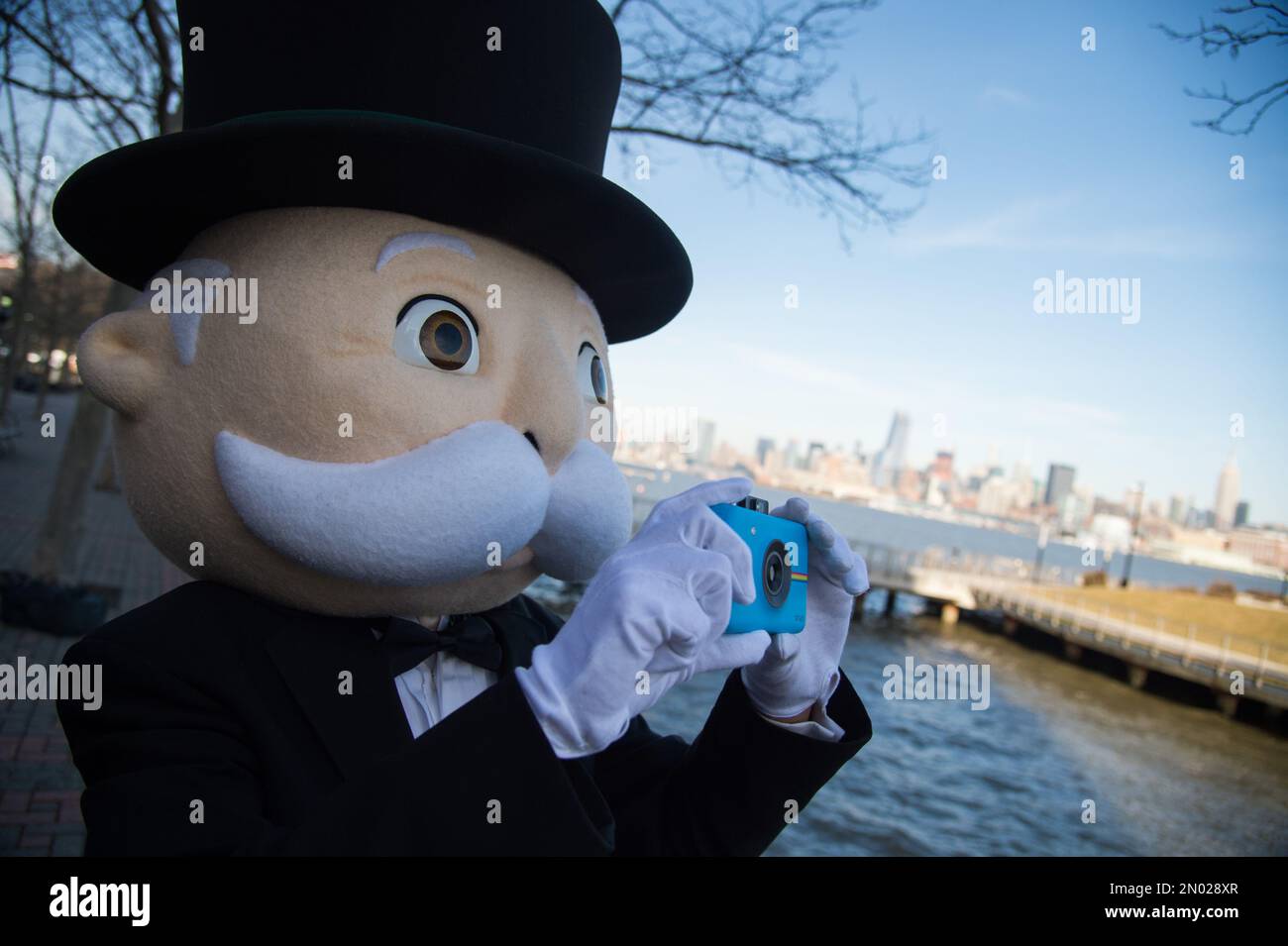 IMAGE DISTRIBUTED FOR HASBRO – MR. MONOPOLY snaps a Polaroid photo of ...