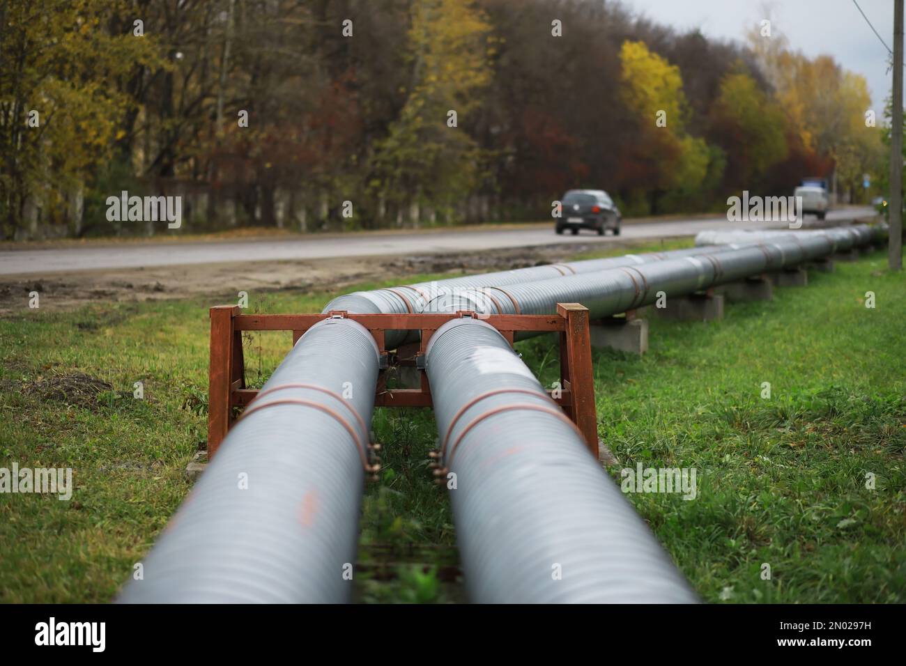 Metal pipes on the street. pipes from the pipeline. gas pipeline for ...