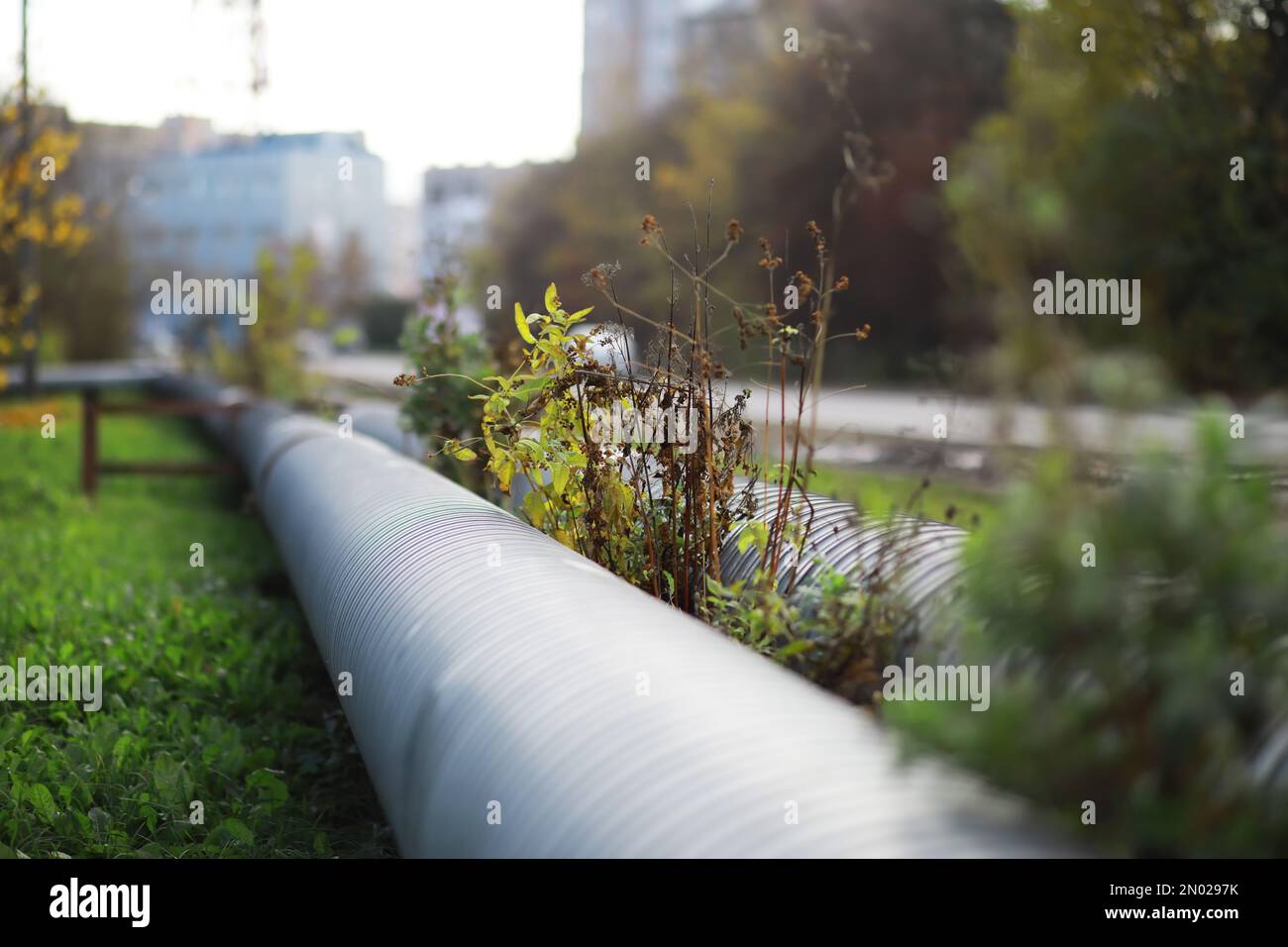 Metal pipes on the street. pipes from the pipeline. gas pipeline for ...