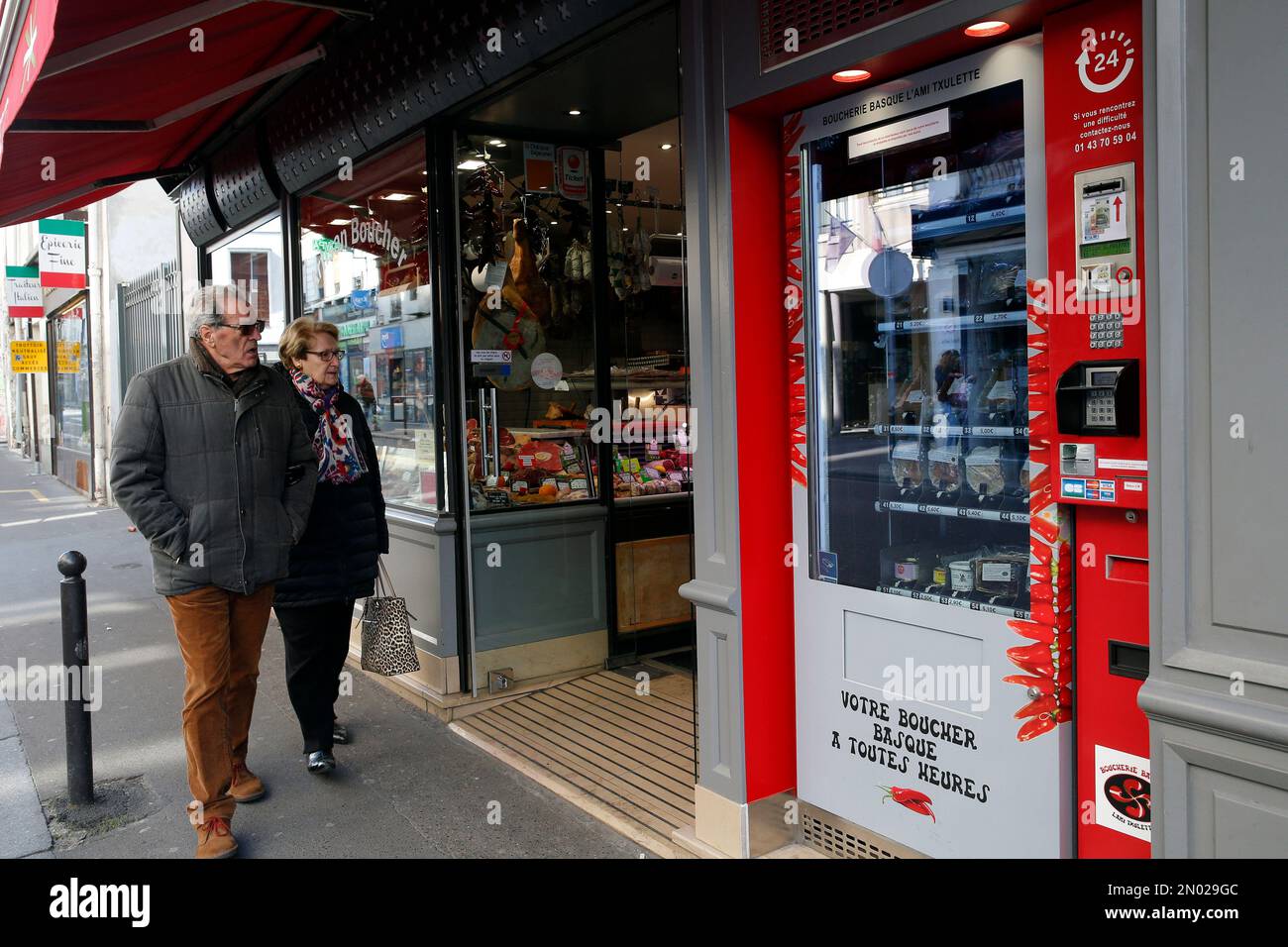 Residents watch the first meat vending machine installed in the French ...
