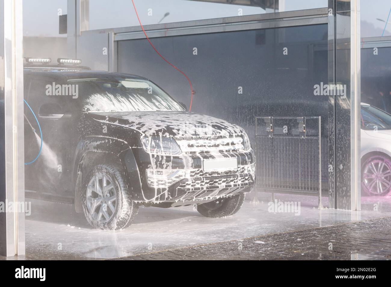 Process of cleaning car with a jet sprayer. Self service car washing ...