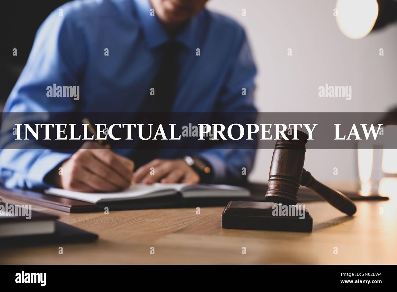 Intellectual property law. Jurist working at table in office, focus on ...