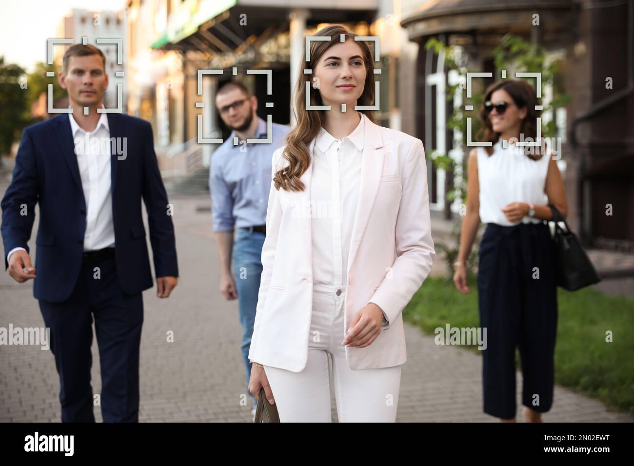 Facial recognition system identifying people on city street Stock Photo ...