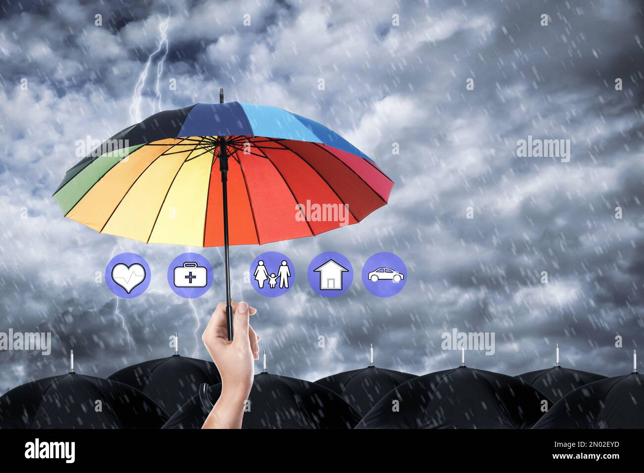 Insurance agent covering illustrations with rainbow umbrella during ...