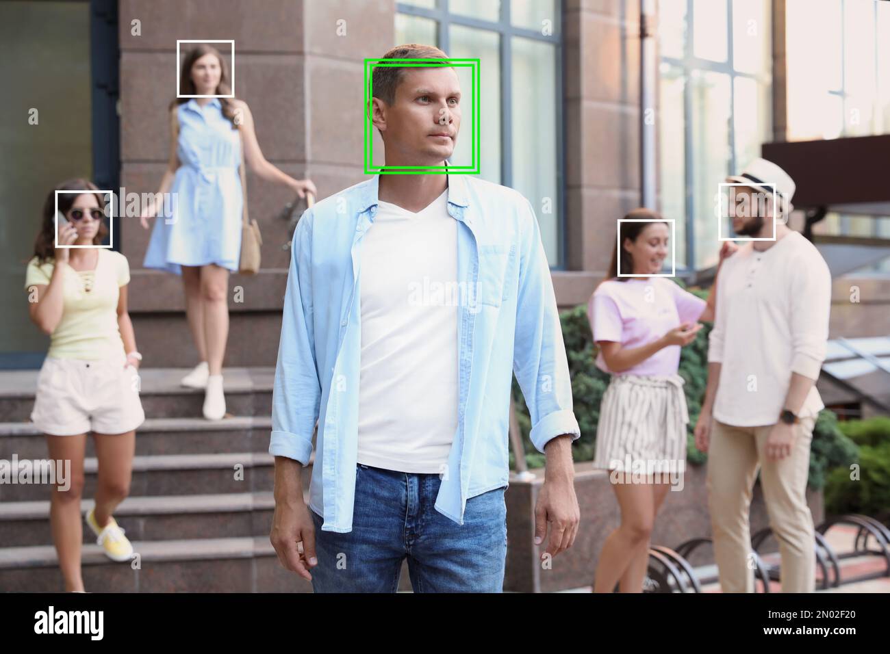 Facial recognition system identifying people on city street Stock Photo ...