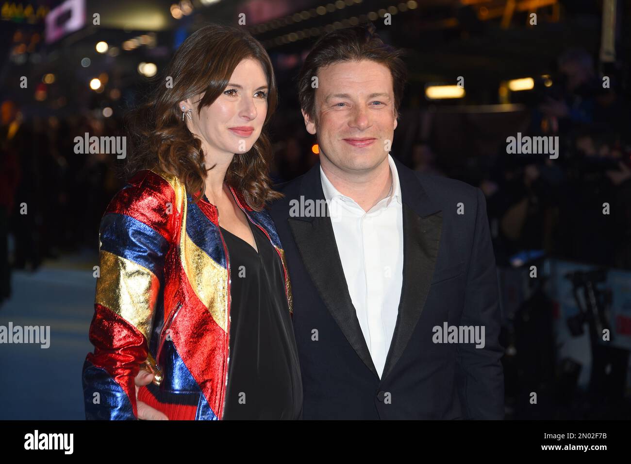 Chef Jamie Oliver, right, and Juliette Norton pose for photographers ...
