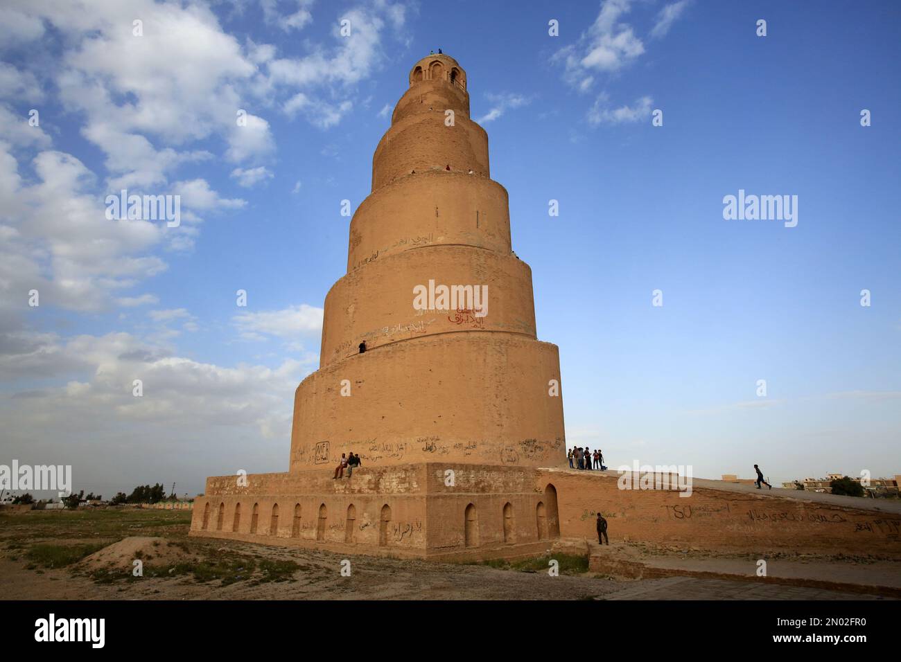 People visit the al-Malwiya minaret at the Al-Mutawakkil Mosque in ...