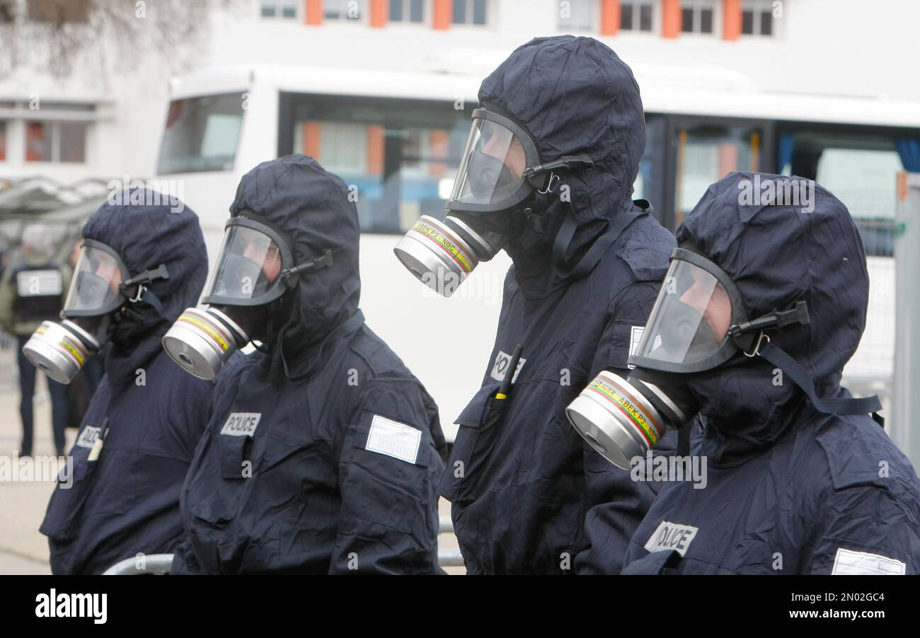 Police officers wear gas masks as they train for a chemical attack at ...