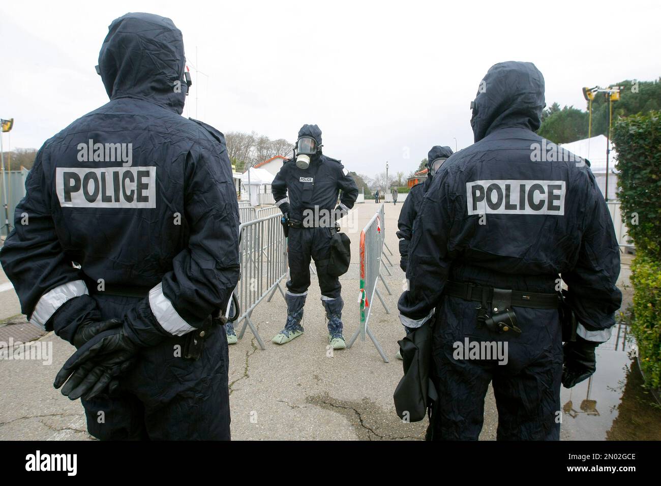 Police officers wear gas masks as they train for a chemical attack at ...