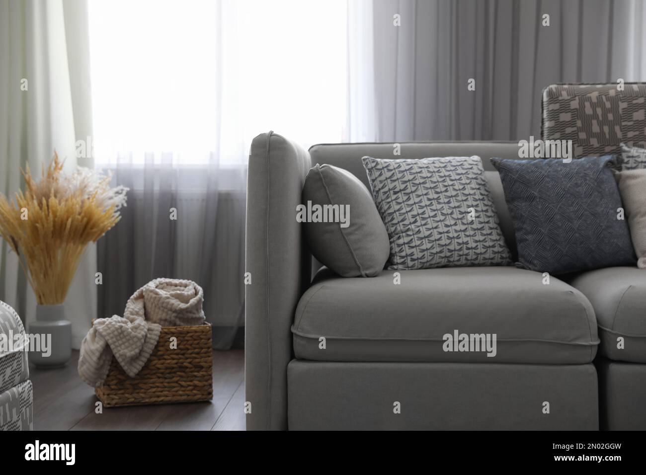 Elegant living room with comfortable sofa near window. Interior design ...