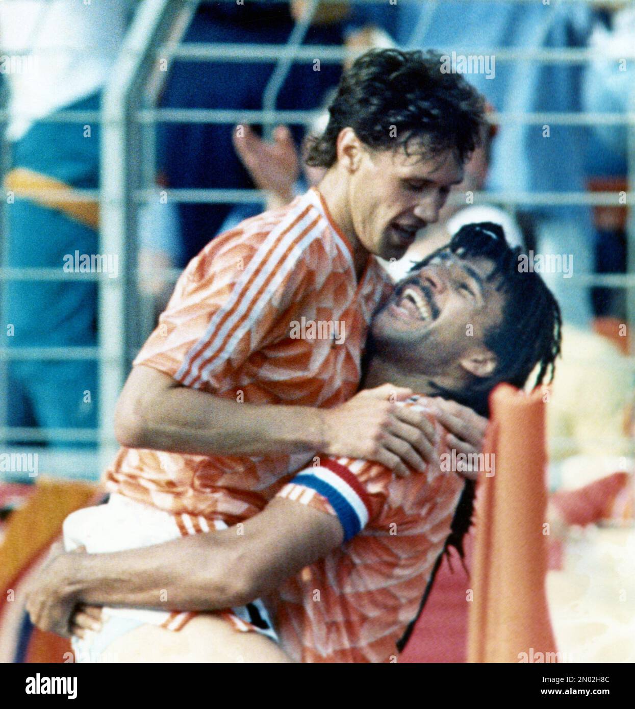 Ruud Gullit of the Netherlands, right, happily smiles at his team mate ...