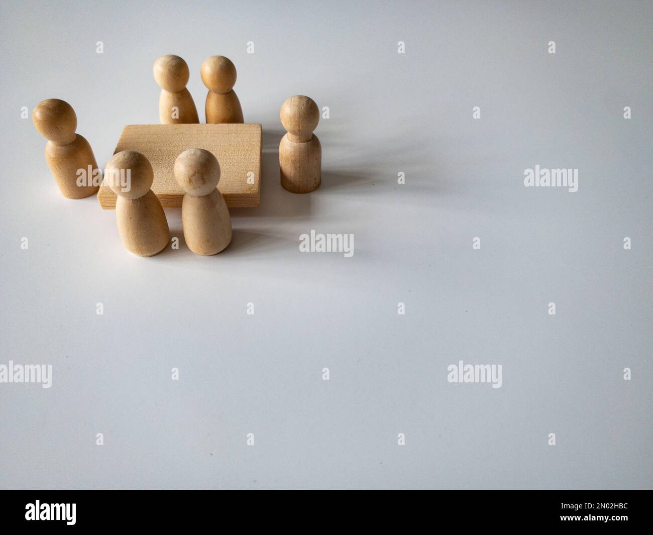 Wooden people figures having business meeting with customizable space ...