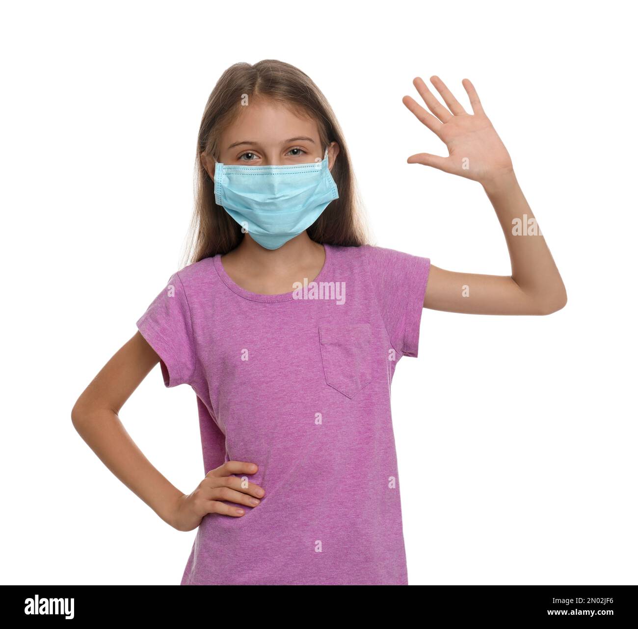 Little girl in protective mask showing hello gesture on white ...