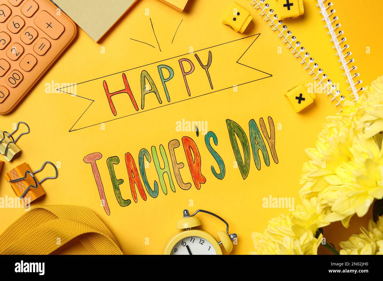 Flat lay composition with words HAPPY TEACHER'S DAY and stationery on ...