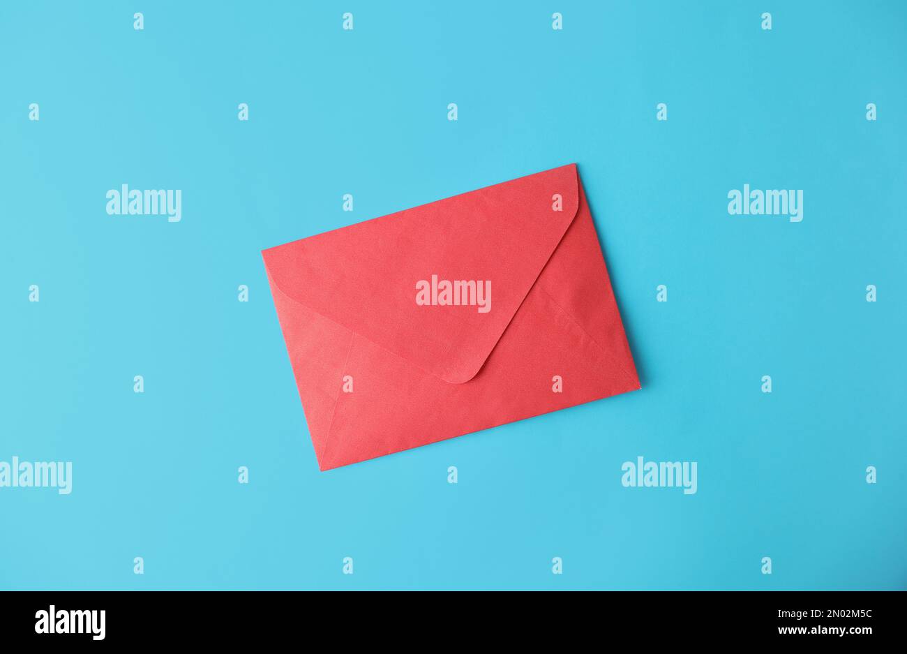 Red paper envelope on light blue background, top view Stock Photo - Alamy