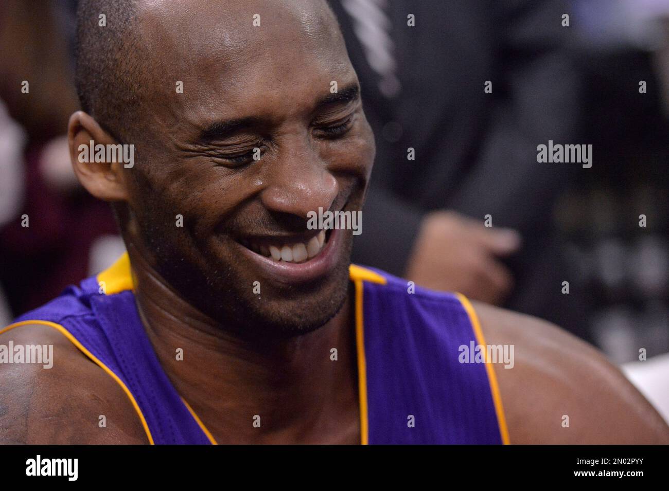 Los Angeles Lakers forward Kobe Bryant jokes with fans from the bench ...