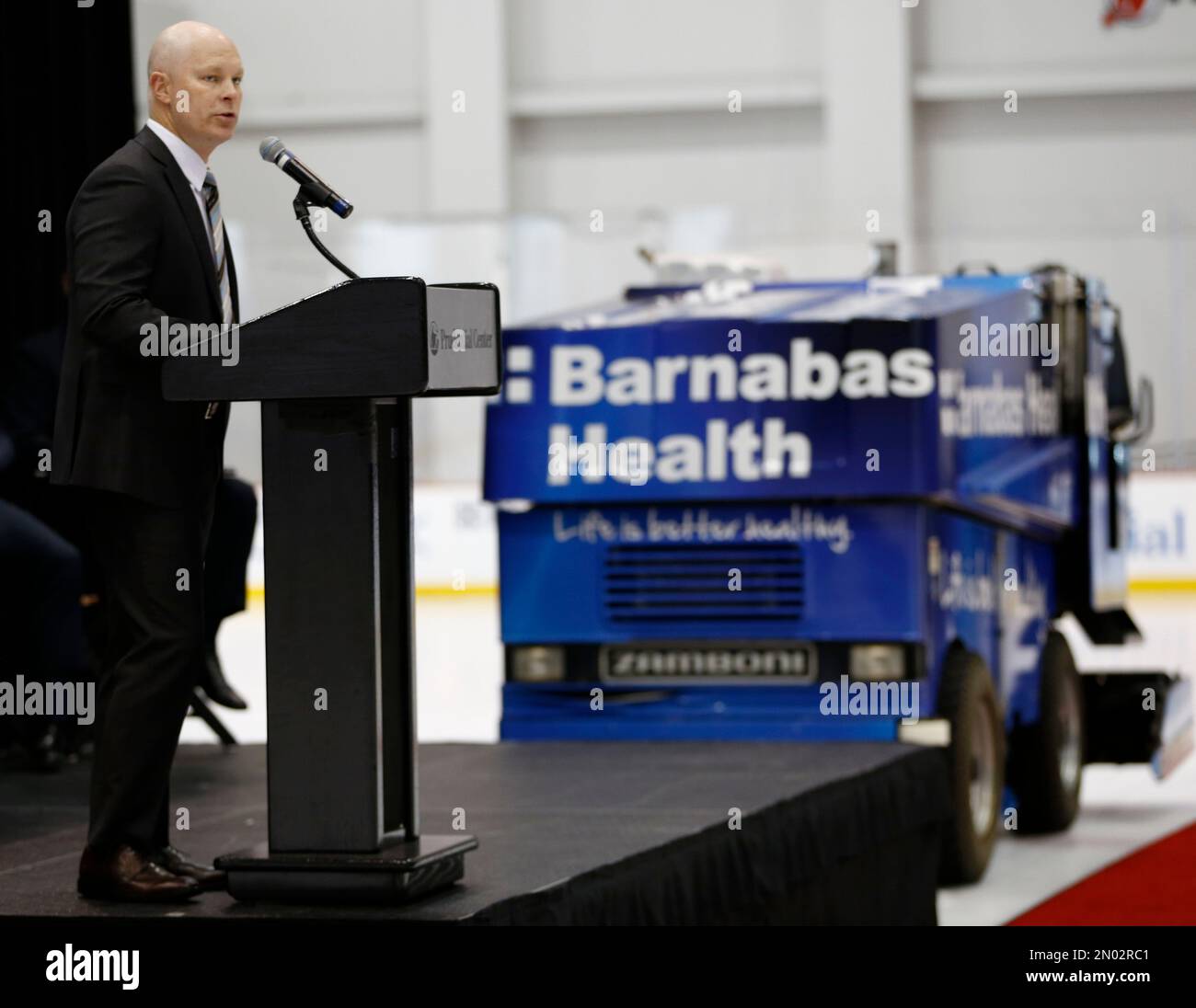 New Jersey Devils head coach John Hynes speaks during an event giving a ...
