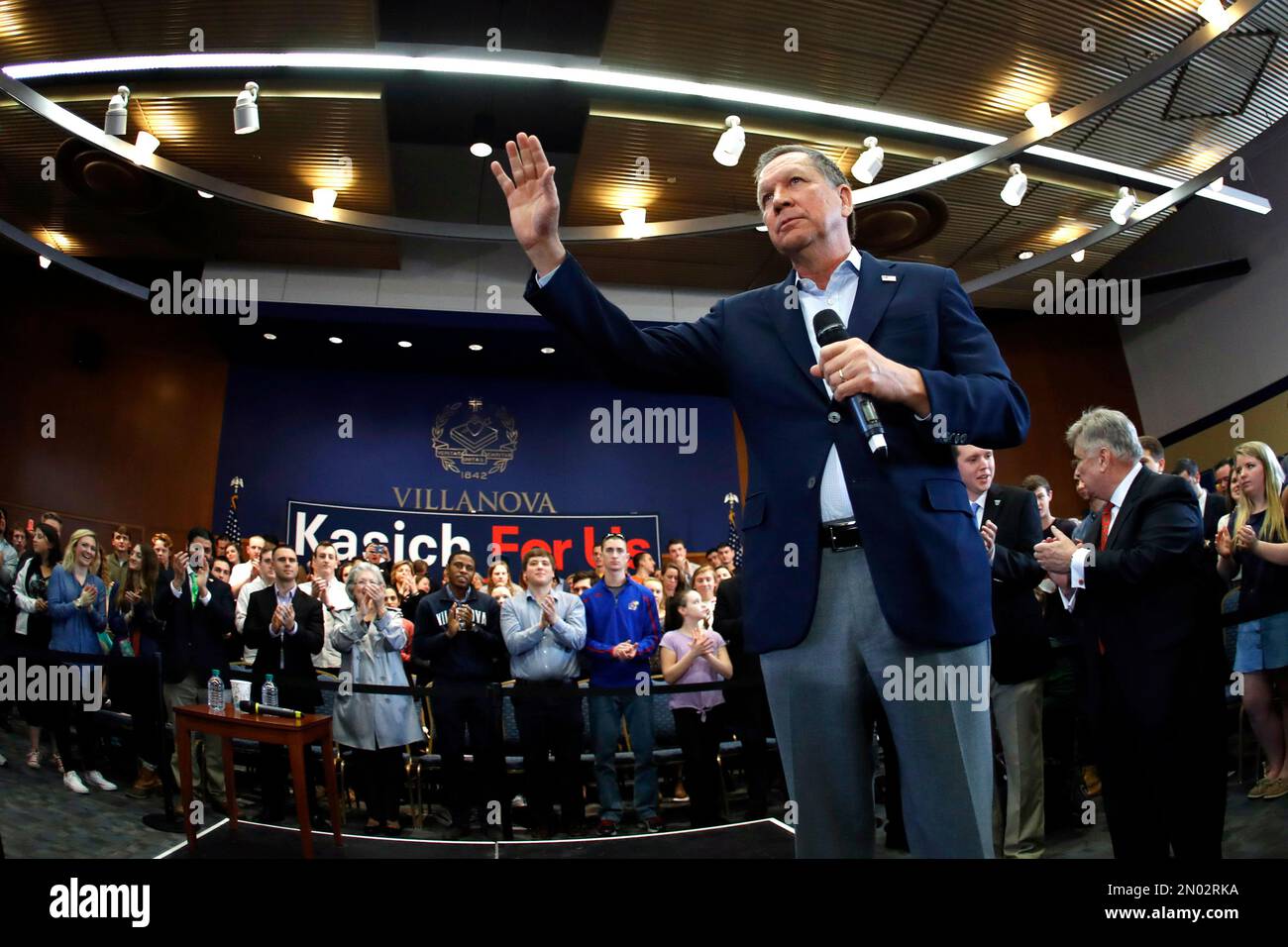 Republican presidential candidate Ohio Gov. John Kasich waves as he ...