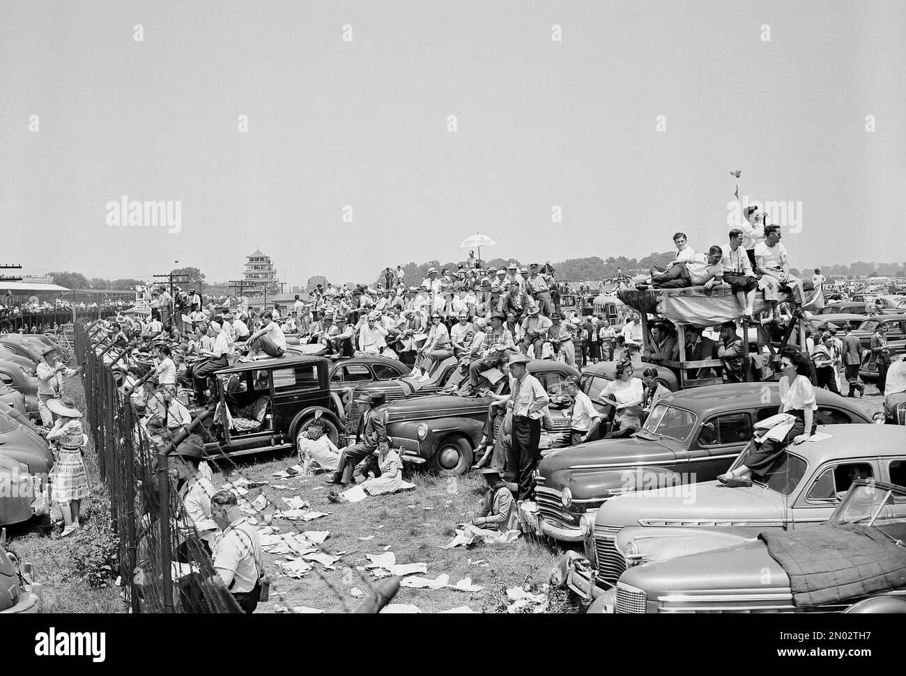 FILE - In this May 30, 1946, file photo, spectators sit on and around ...