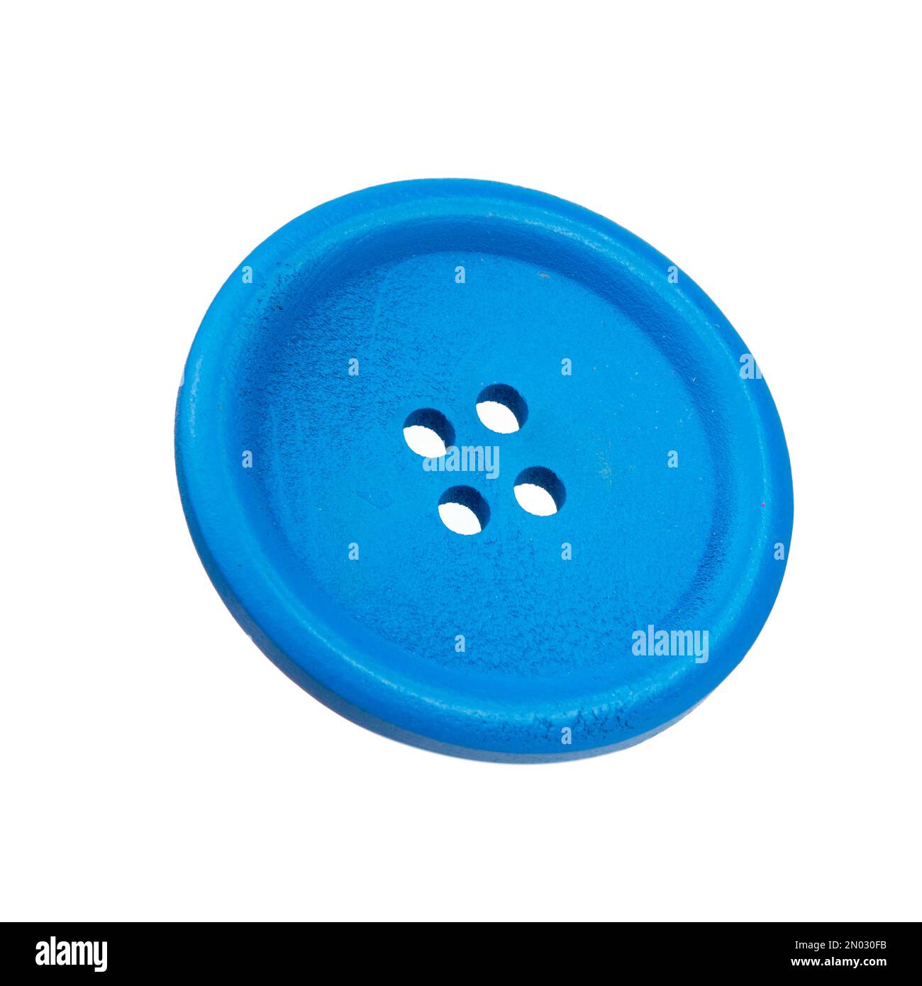 Wooden cloth button macro for sewing isolated on the white background ...