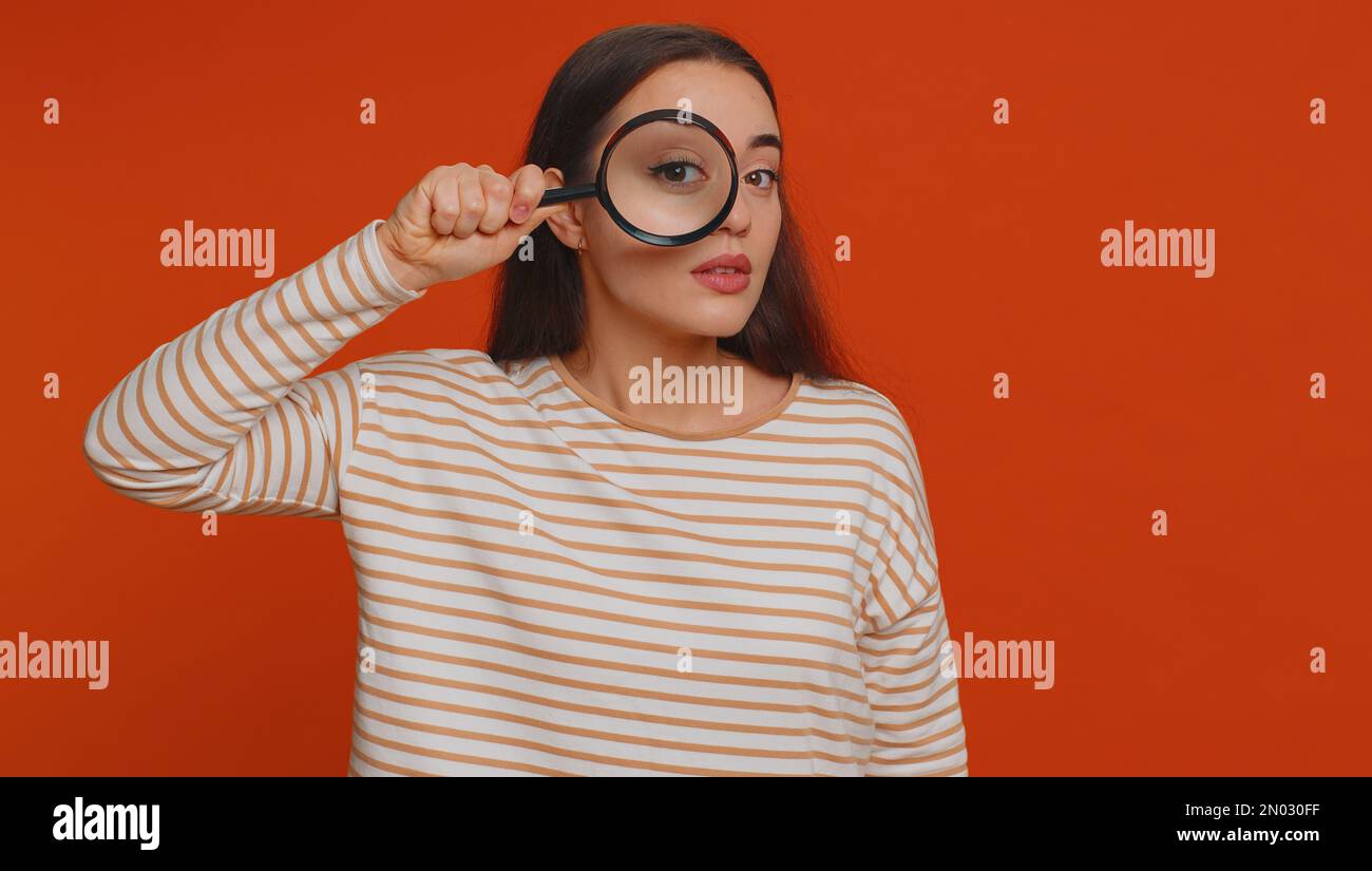 Investigator researcher scientist woman holding magnifying glass near ...