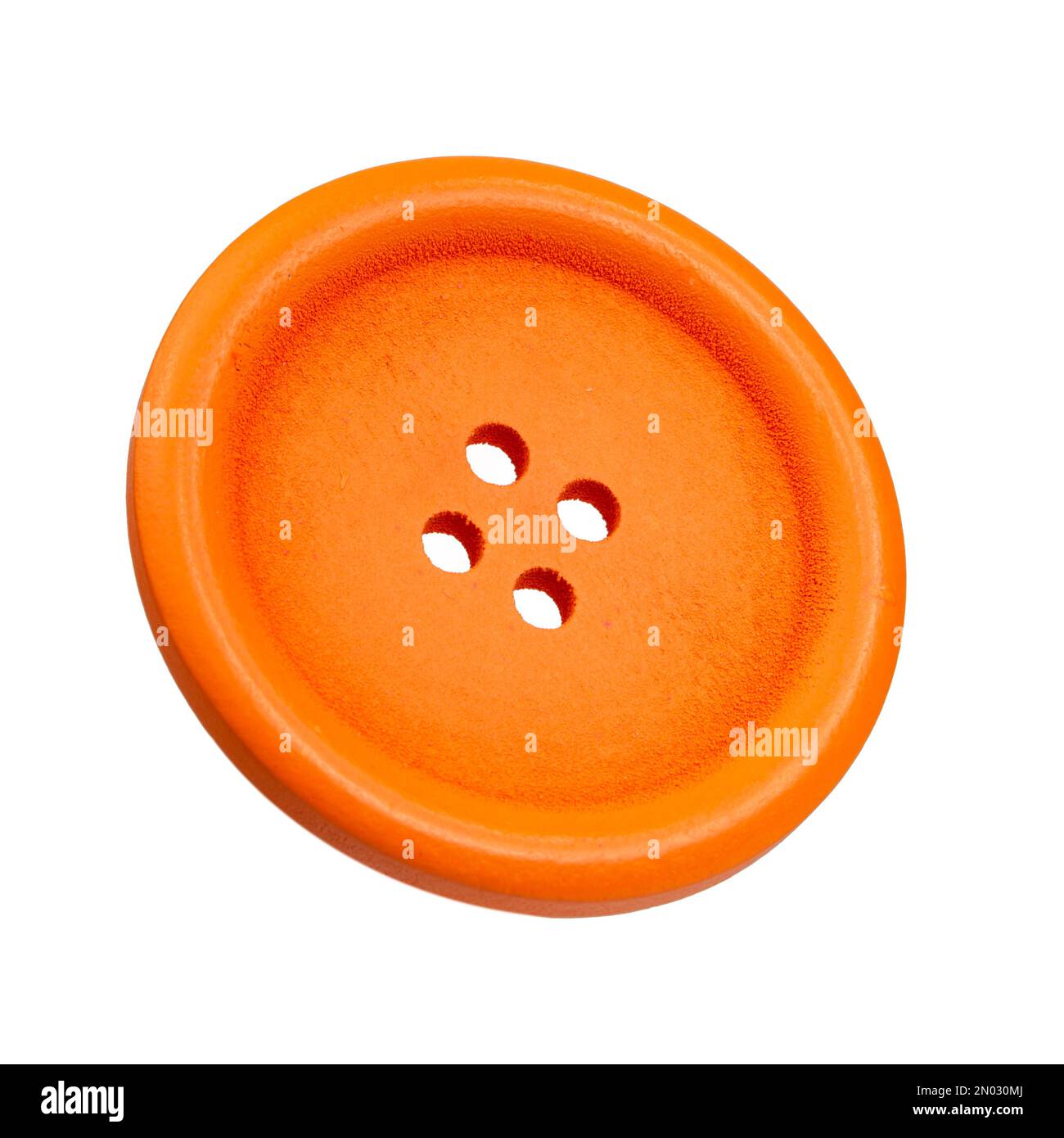 Wooden cloth button macro for sewing isolated on the white background ...