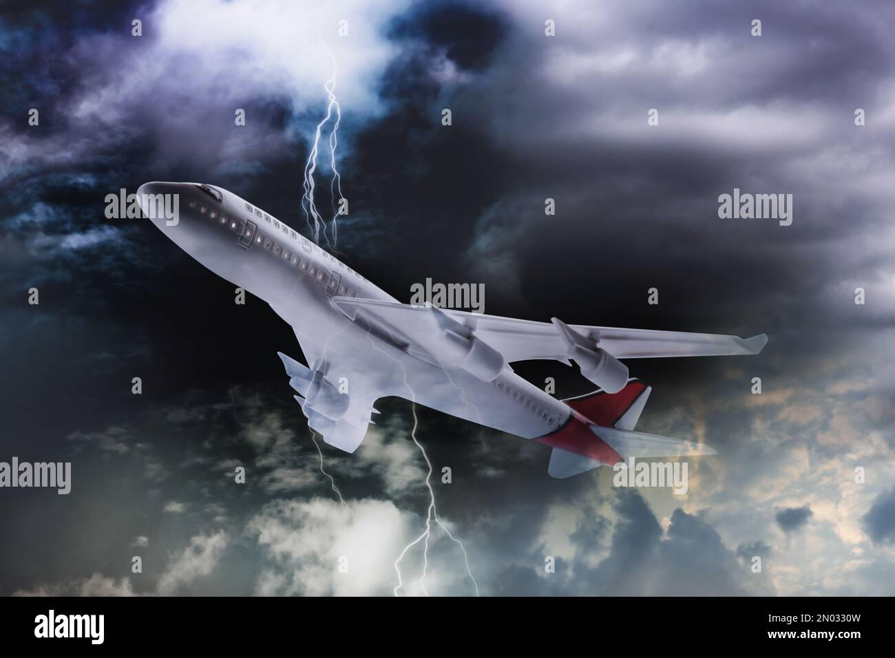 Airplane flying in cloudy sky during thunderstorm Stock Photo - Alamy