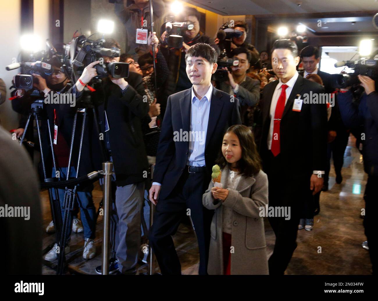 South Korean professional Go player Lee Sedol, center, arrives at a ...