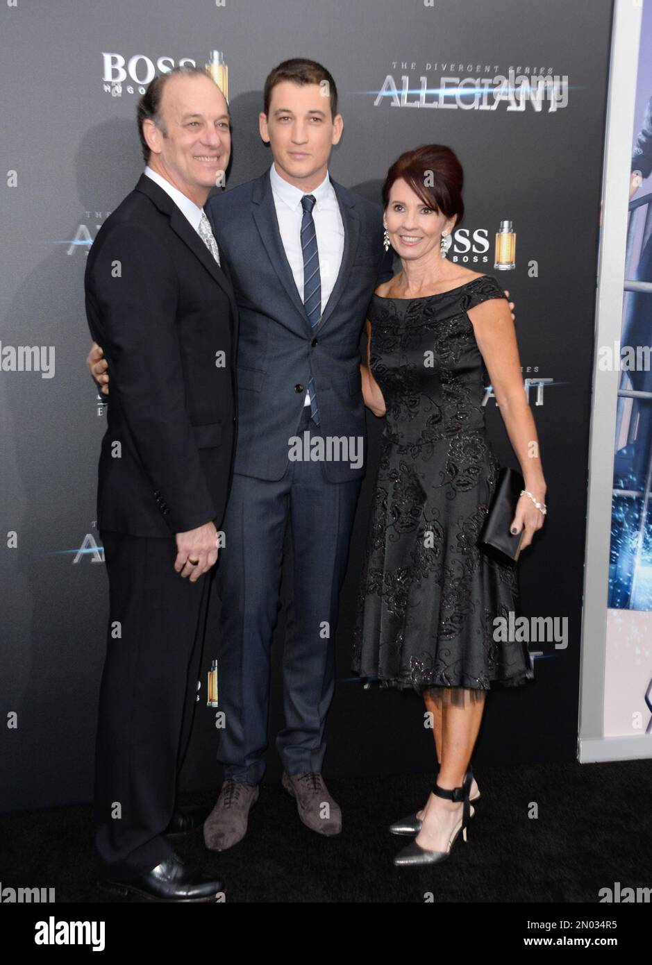 Actor Miles Teller, center, poses with his parents Mike and Merry ...