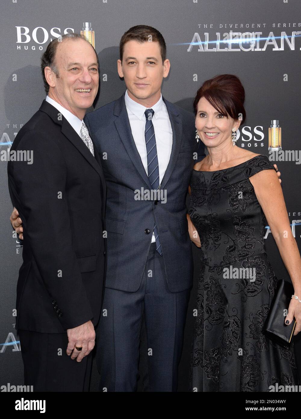 Actor Miles Teller, center, poses with his parents Mike and Merry ...
