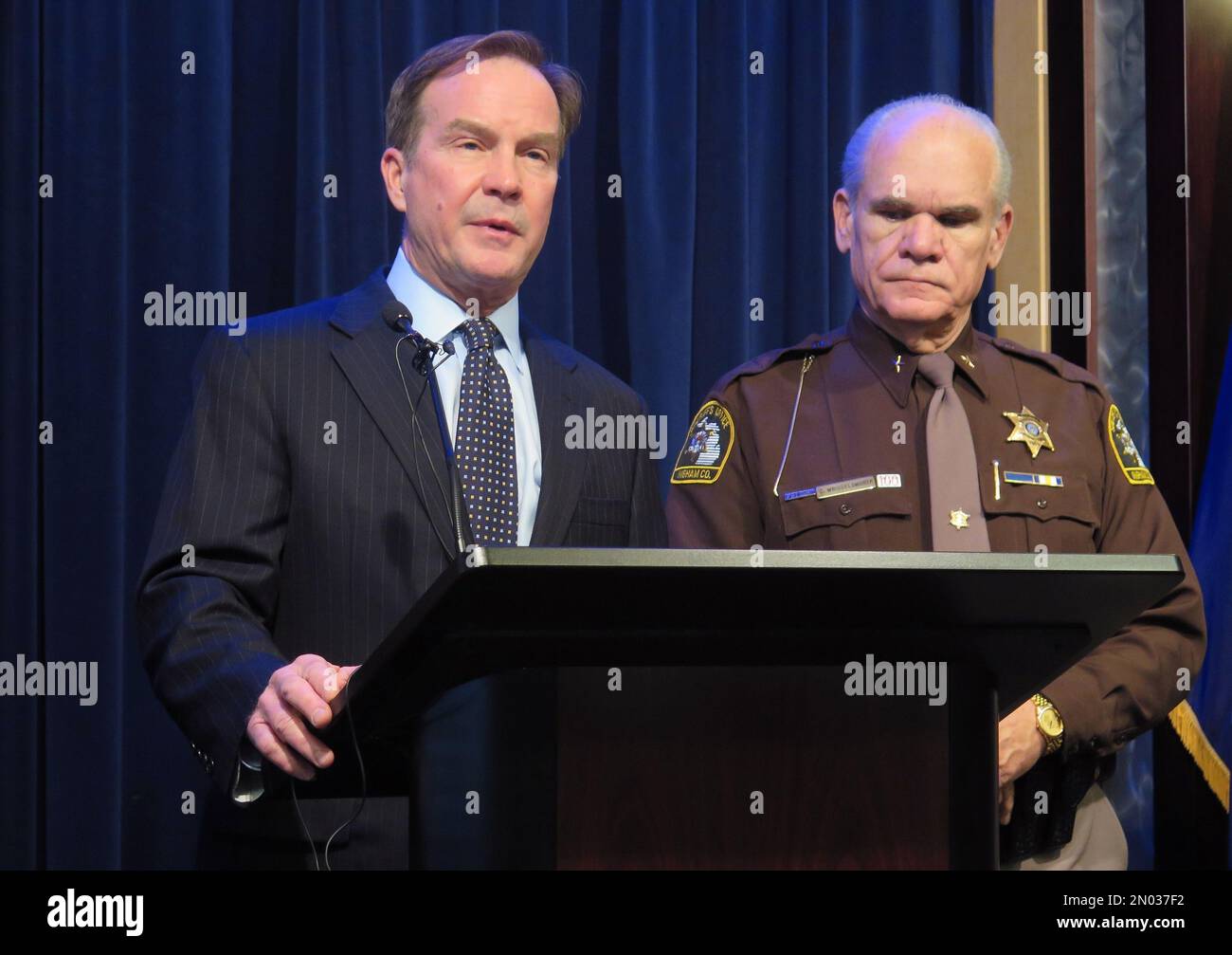 Michigan Attorney General Bill Schuette, left, and Ingham County ...