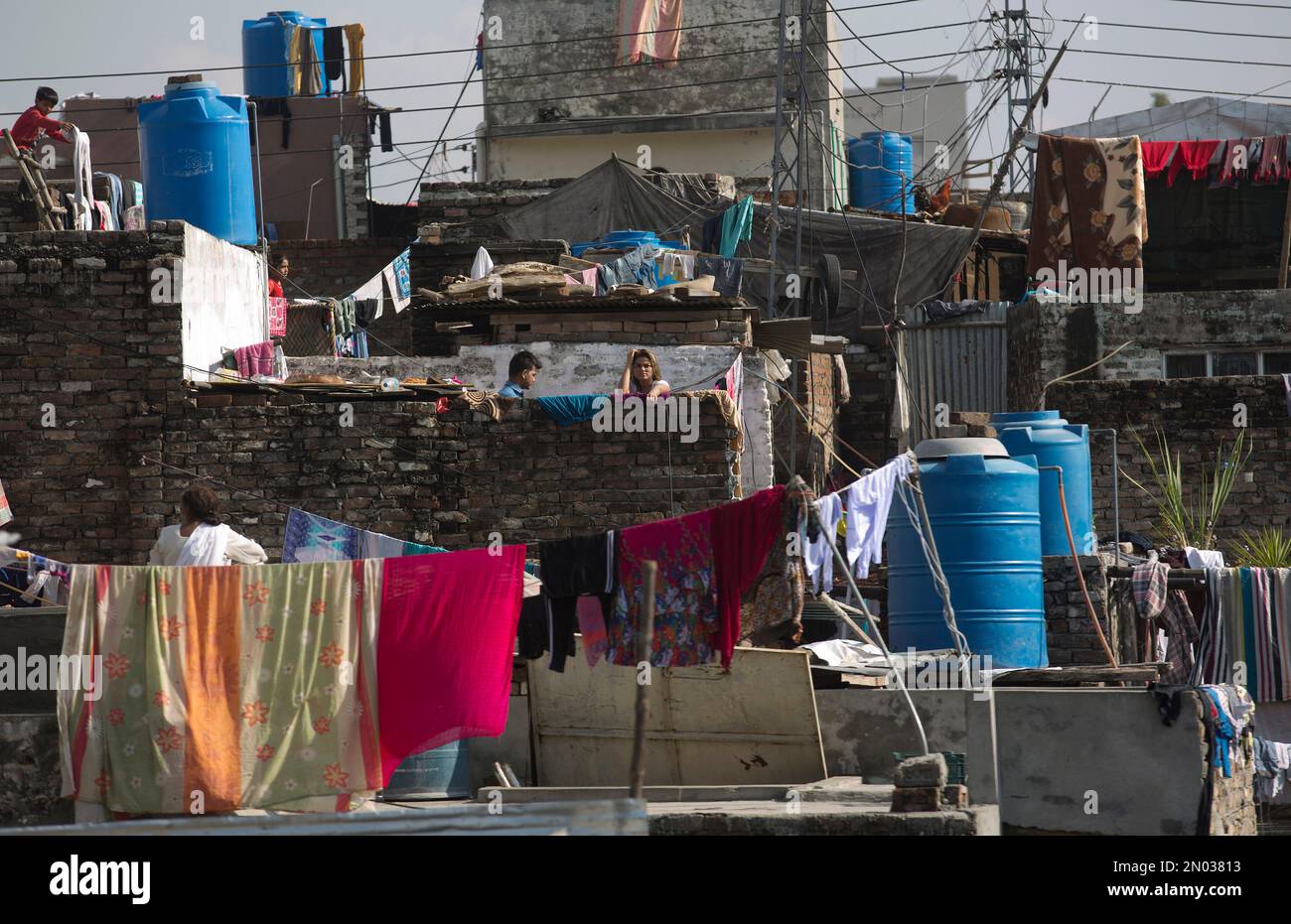People dry their laundry after three-days of rain in Islamabad ...