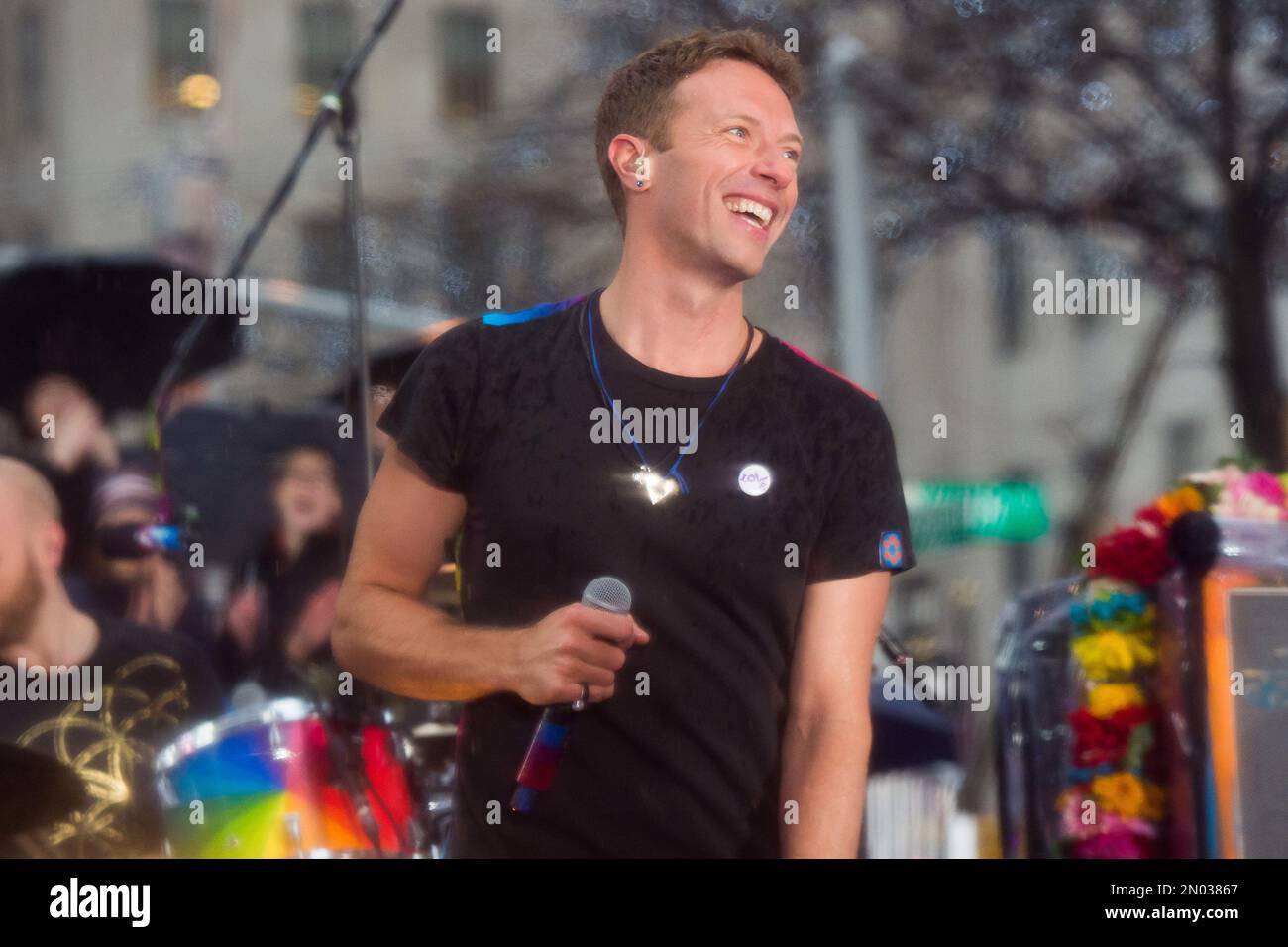 Chris Martin from the band Coldplay performs in the rain on NBC's ...