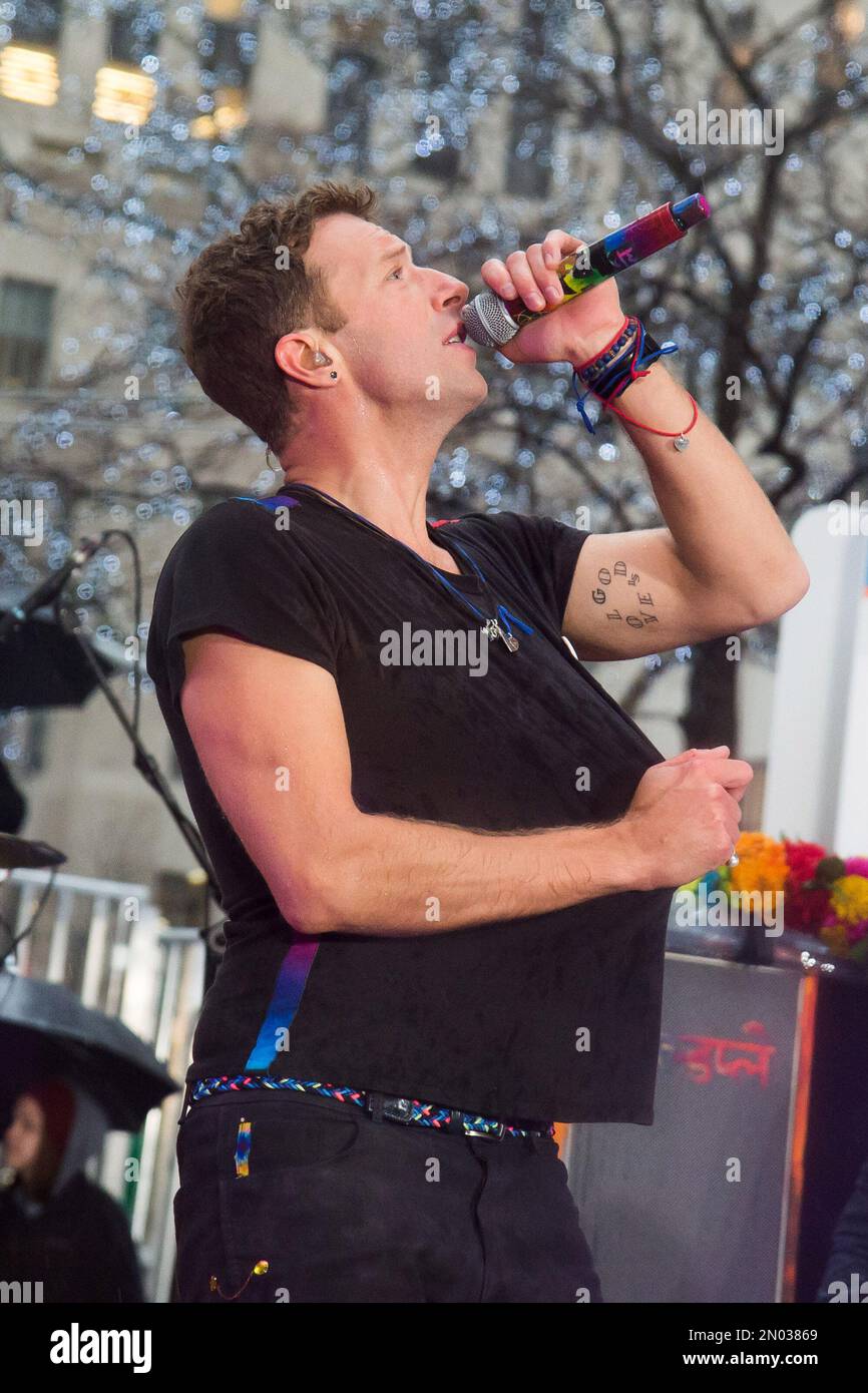 Chris Martin from the band Coldplay performs in the rain on NBC's ...