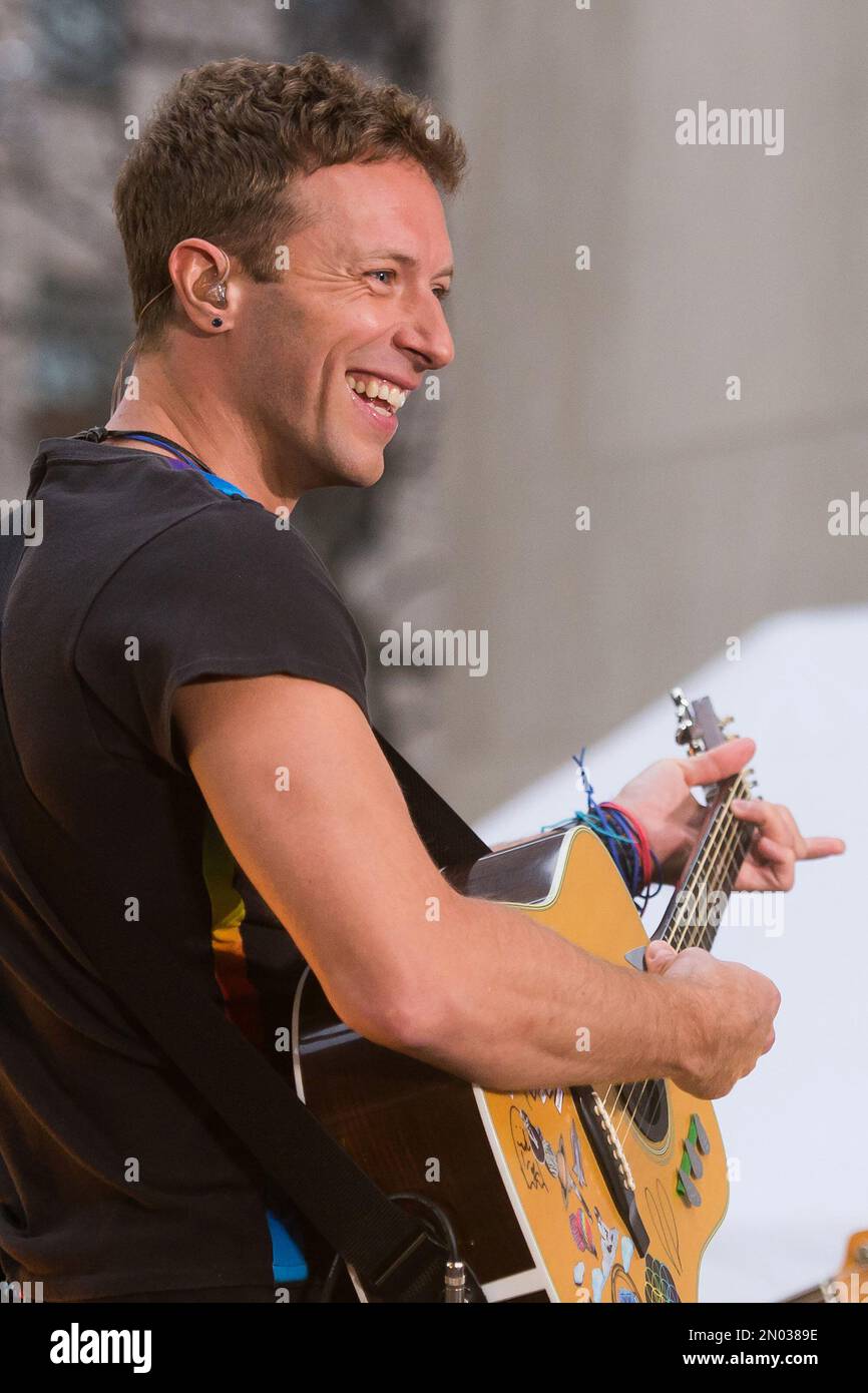 Chris Martin from the band Coldplay performs in the rain on NBC's ...