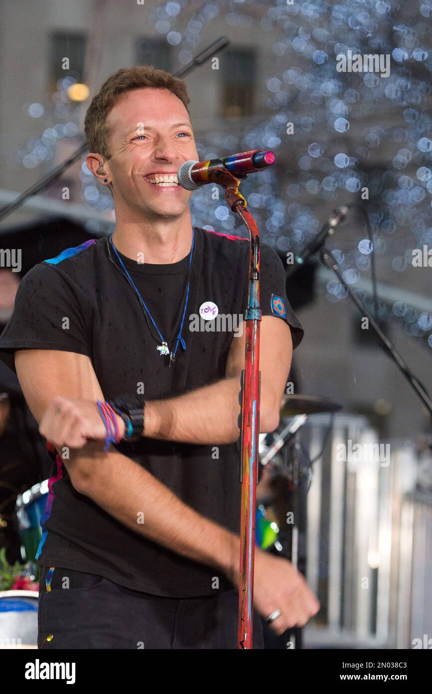 Chris Martin from the band Coldplay performs in the rain on NBC's ...