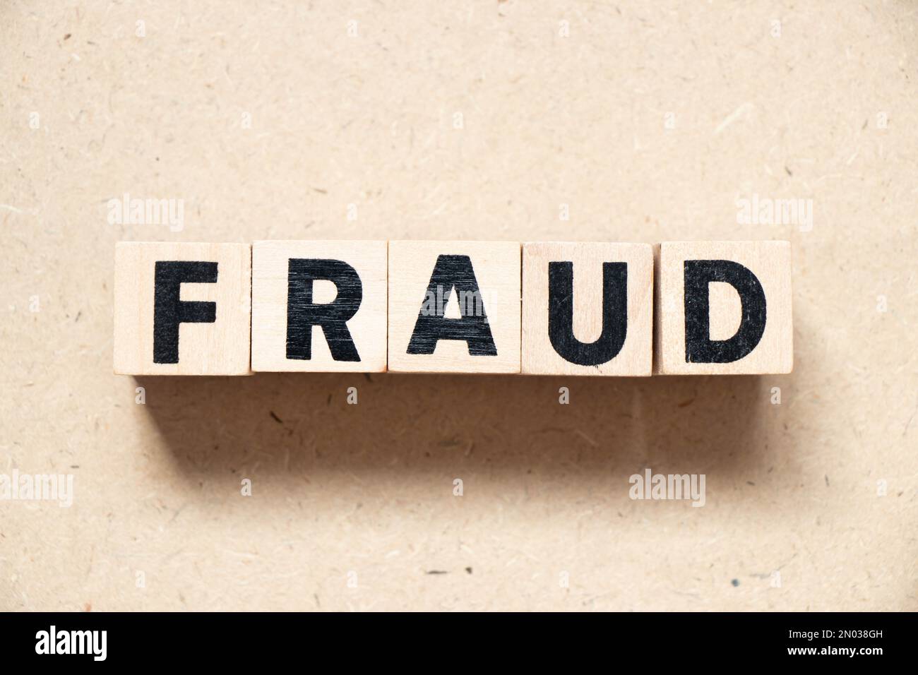 Alphabet letter block in word fraud on wood background Stock Photo - Alamy