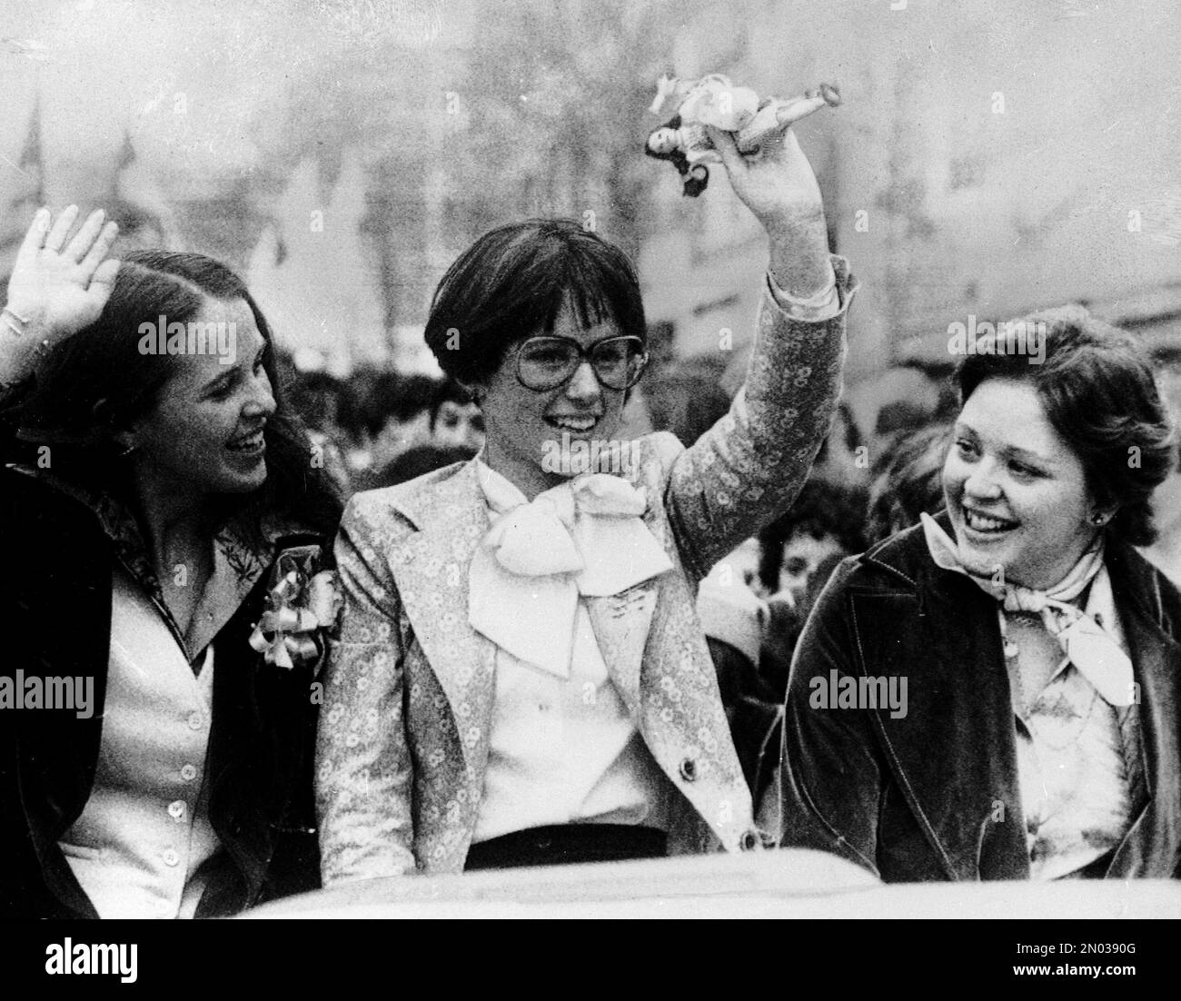 Dorothy Hamill, center, waves to the crowd as she rode in a motorcade ...