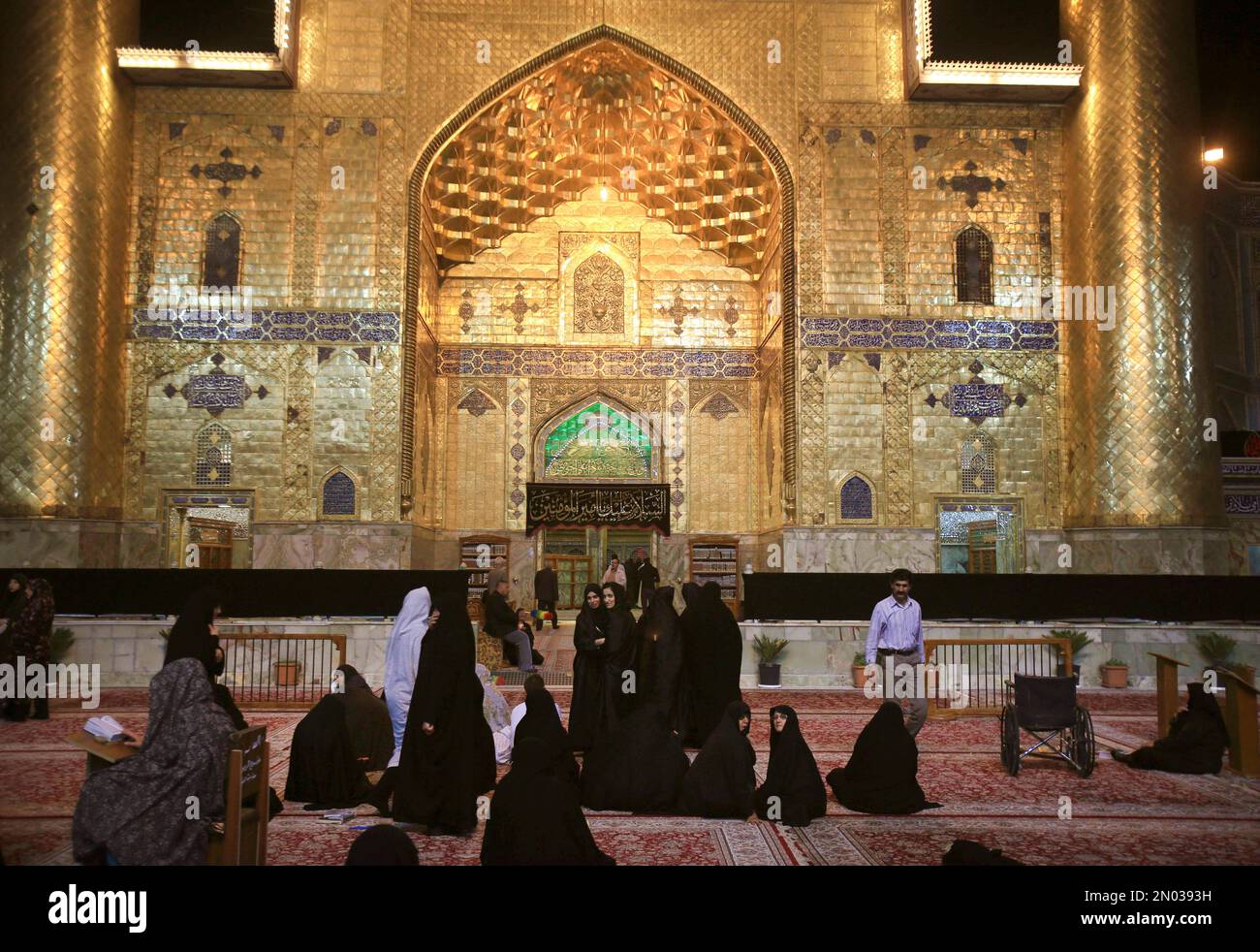 Shiite Muslim pilgrims visit the holy shrine of Imam Ali, the son-in ...